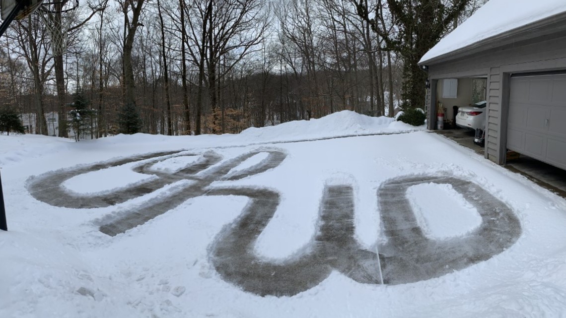 Man shovels Script Ohio, Block O in snow following Monday's storm ...