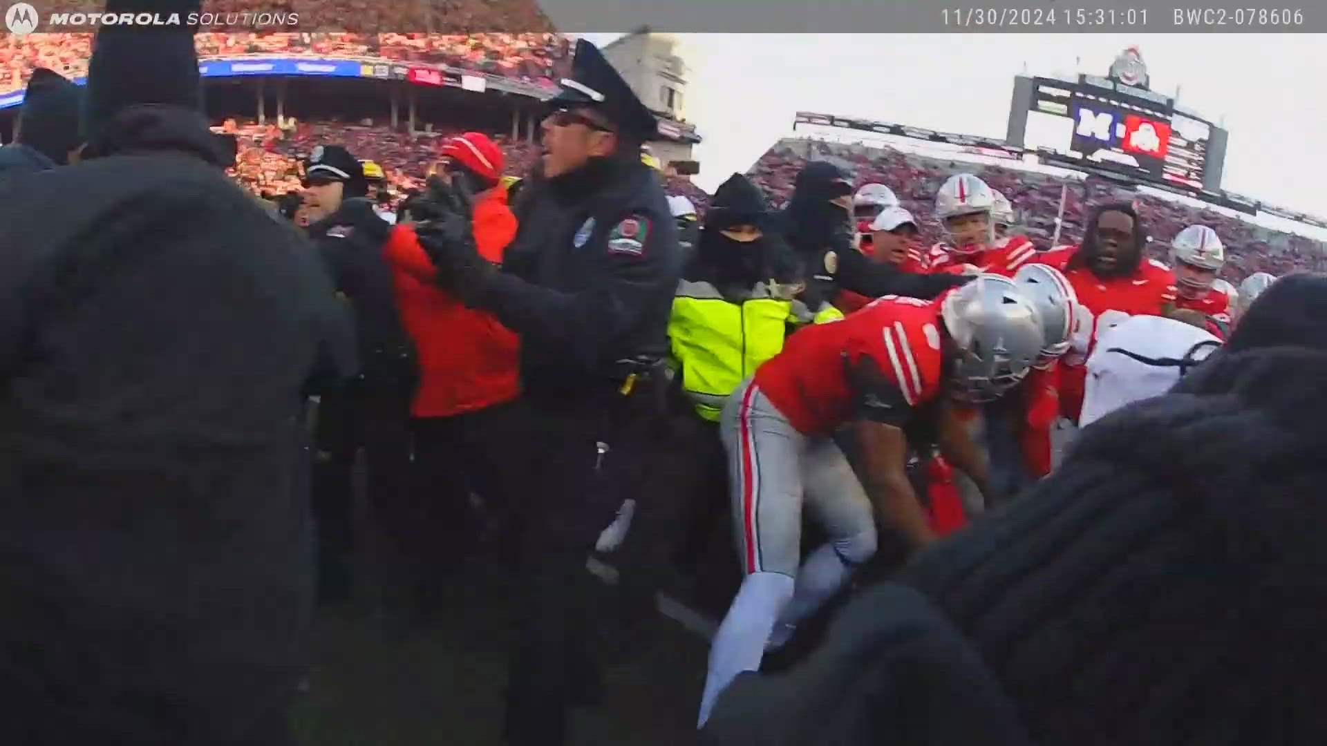 Officer who deployed pepper spray during Ohio State-Michigan fight cleared of any wrongdoing ...
