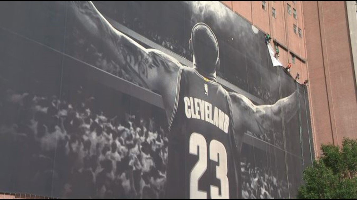 PHOTOS | Iconic LeBron James banner comes down in Cleveland | wkyc.com