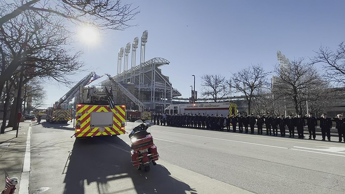 Cleveland Fire Engine 22 passes Progressive Field carrying firefighter ...