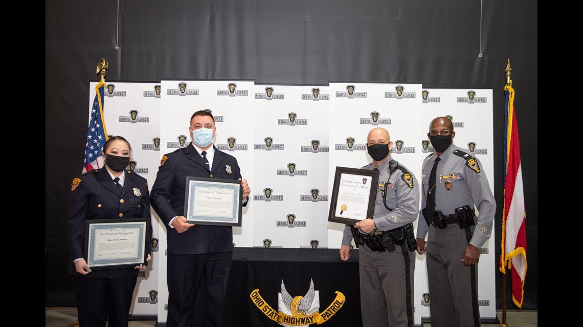 Troopers, Cleveland officers honored for saving couple from fire | wkyc.com
