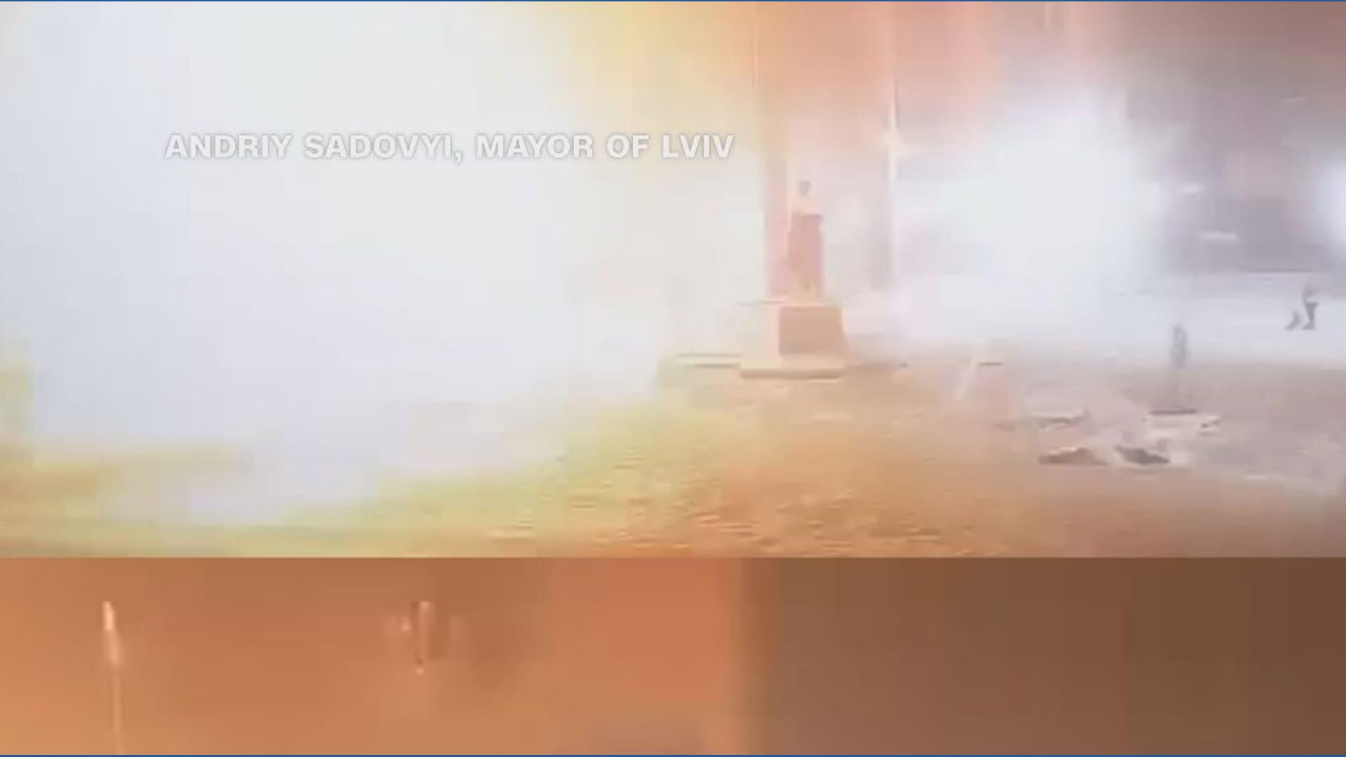 Woman in Ukraine carries on working after explosion in Lviv | wkyc.com