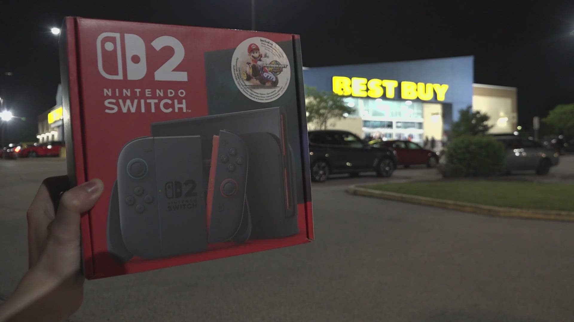 Gamers wait in line at Best Buy in Parma for midnight release of ...