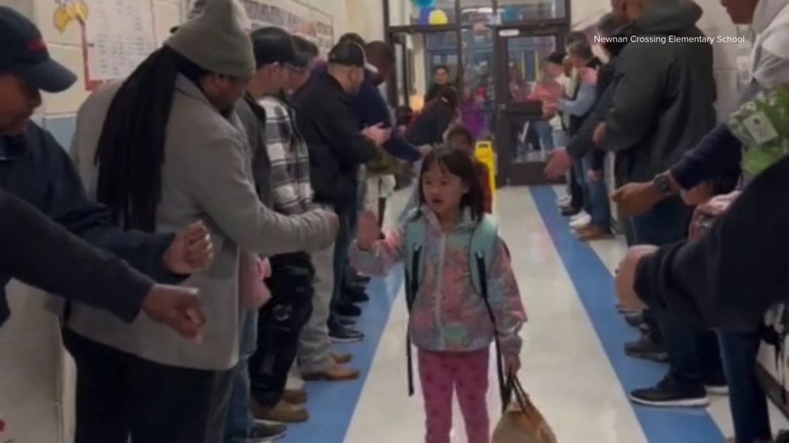 Hundreds of dads make a difference with Newnan Crossing’s ‘Fist Bump Friday’ | wkyc.com